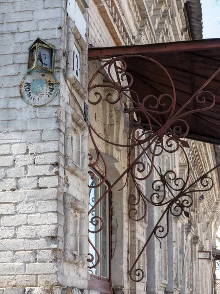 Old rusty broken house number 13 with street lamp. Old retro weathered ...