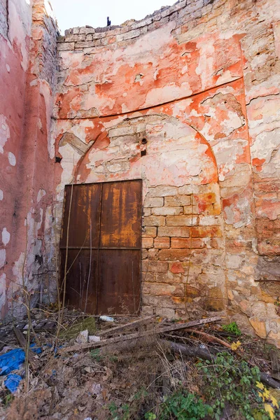 old wooden door in poor quarter. Ancient vintage wooden in an old wall ...