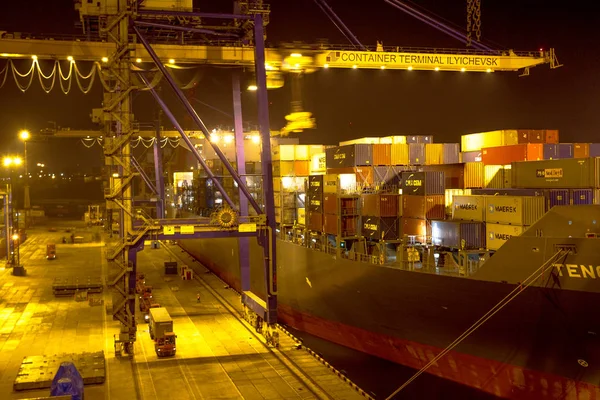 Unloading containers by crane working at container terminals bel Stock ...