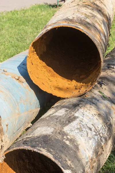 Fragments of old large water pipes. After many years of operation ...