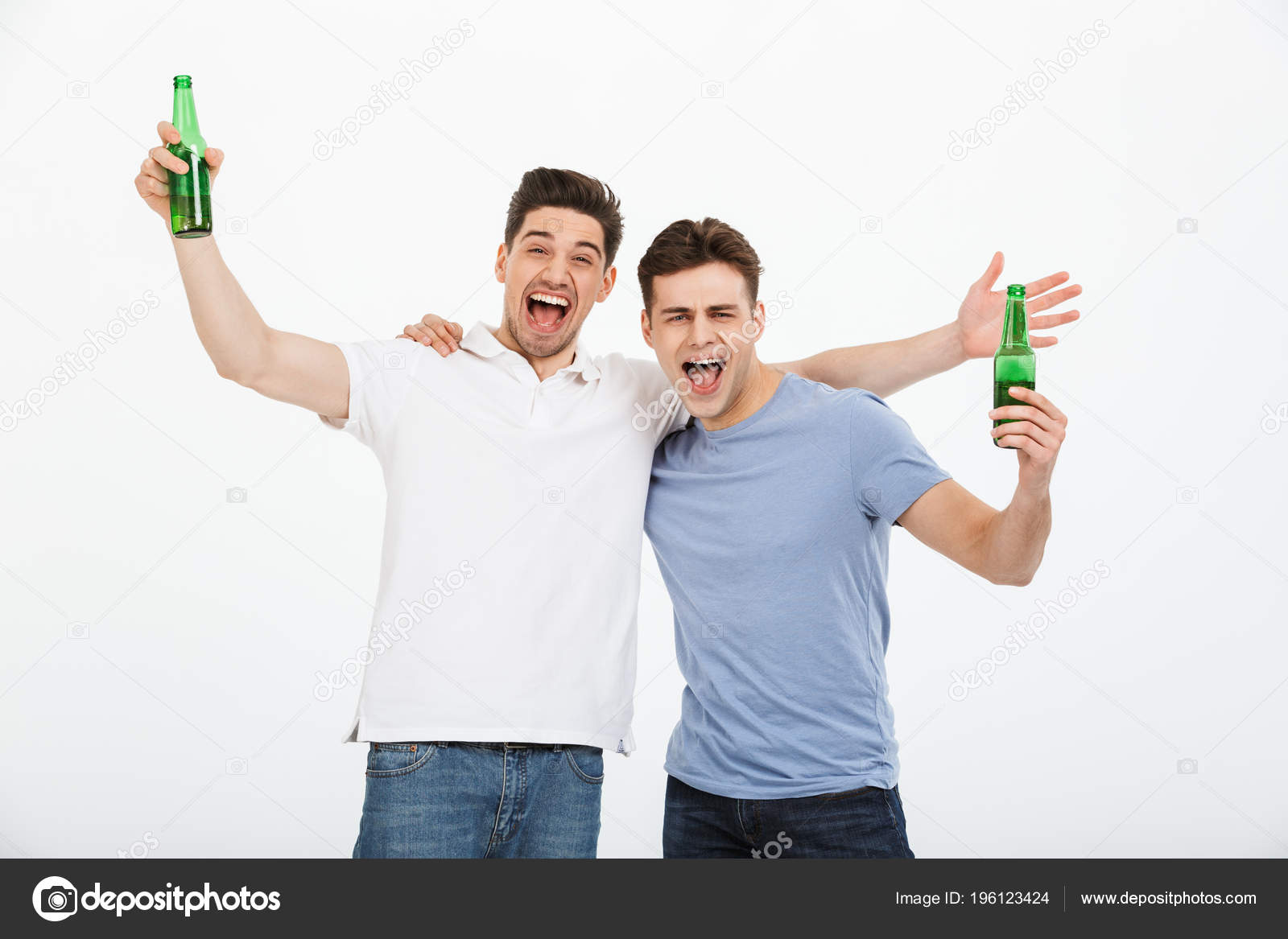 Portrait Two Joyful Young Men Celebrating While Holding Beer Bottles ...