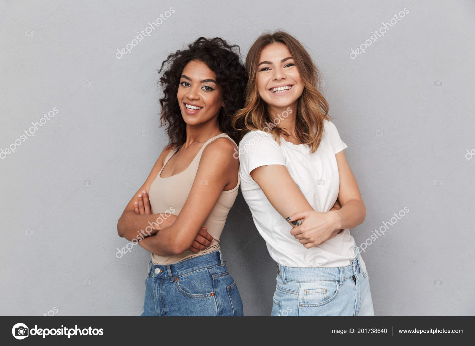 Portrait Two Cheerful Young Women Standing Together Looking Camera ...