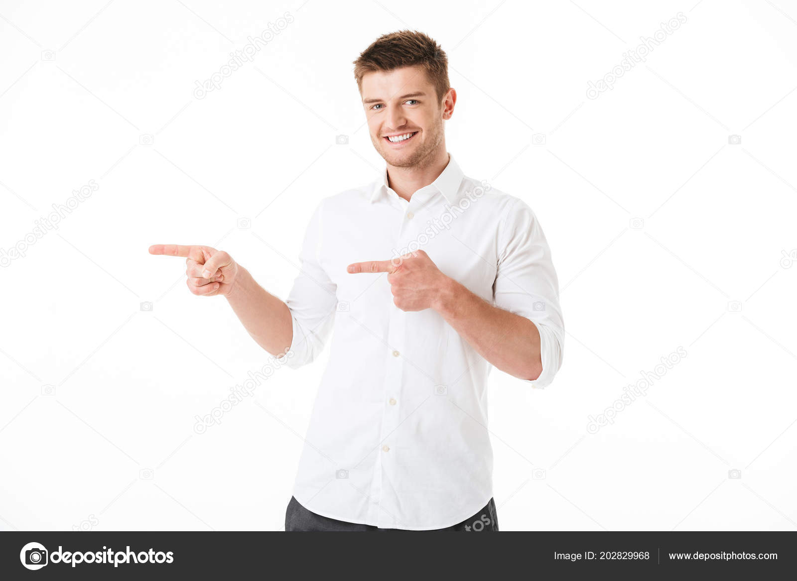 Portrait Smiling Young Man Looking Camera Pointing Away Copy Space ...