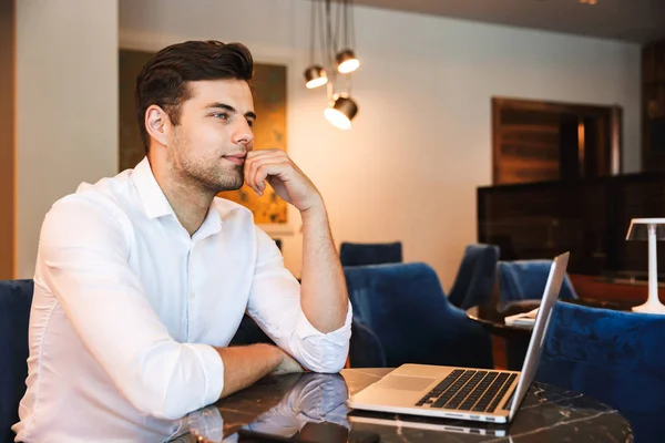 Smiling Young Formal Dressed Man Reading Newspaper While Sitting Hotel ...