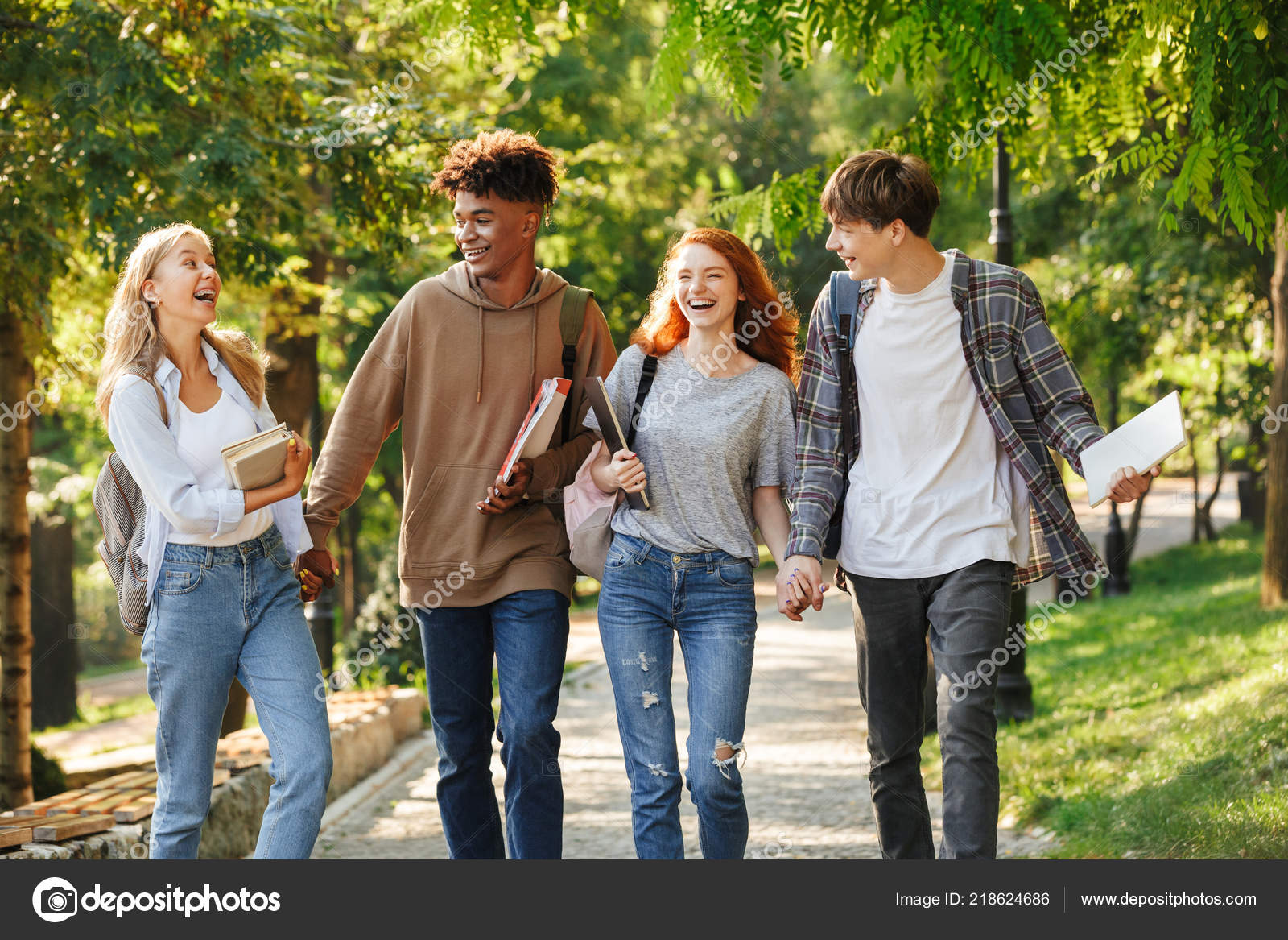 Group Laughing Students Walking Campus Outdoors Stock Photo by ...