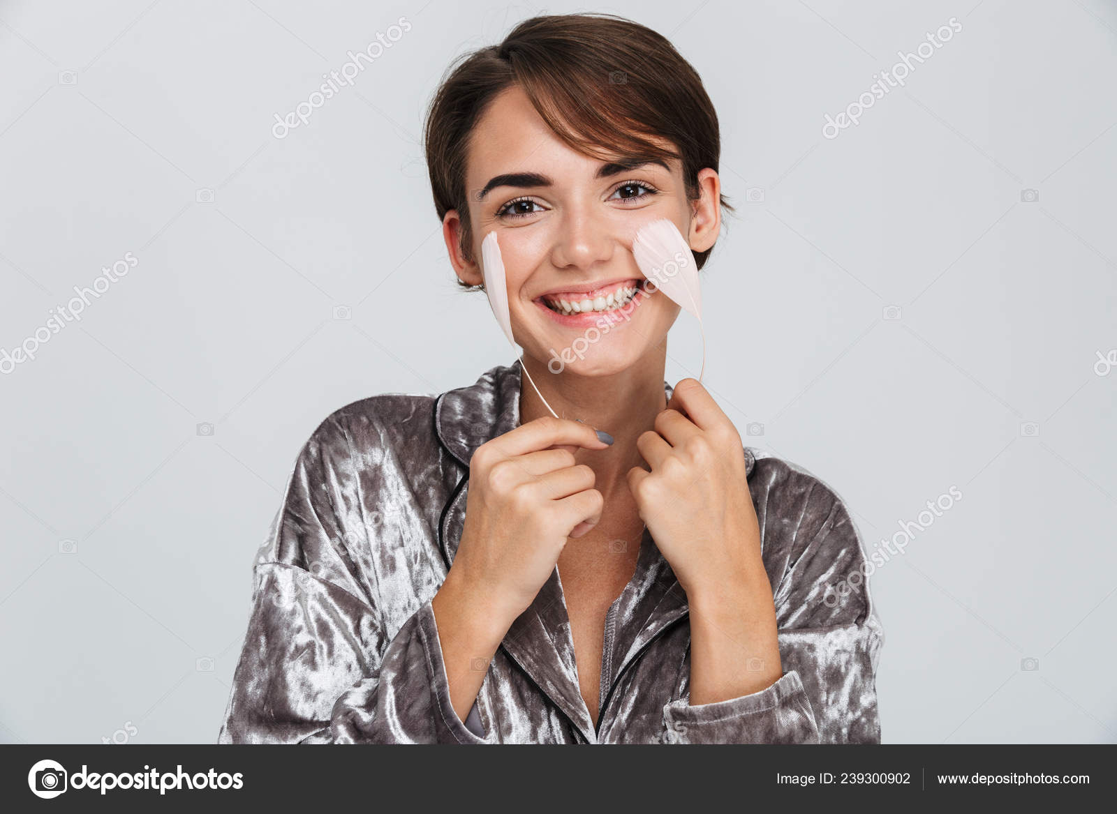 Pretty Young Girl Wearing Pajamas Holding Feather Isolated Gray ... Pretty Young Girl Wearing Pajamas Holding Feather Isolated Gray ...