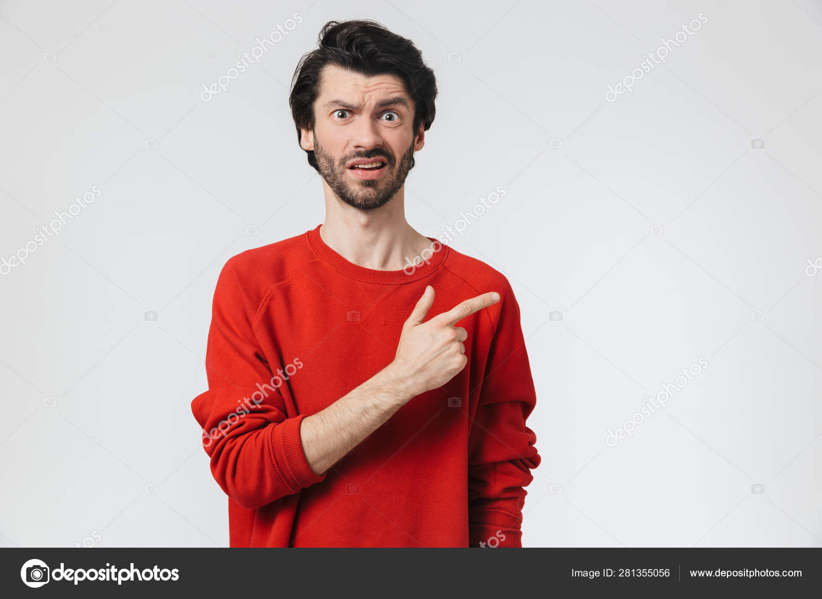 Handsome young confused man posing isolated over white wall background ...