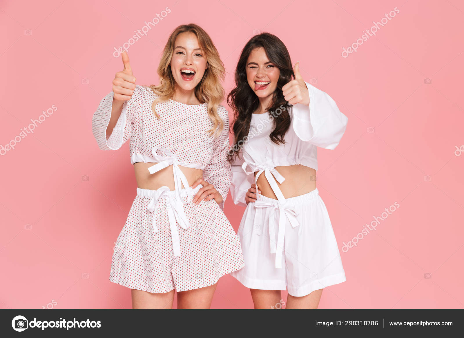 Excited Young Two Pretty Women Girls Friends Sisters Posing Isolated