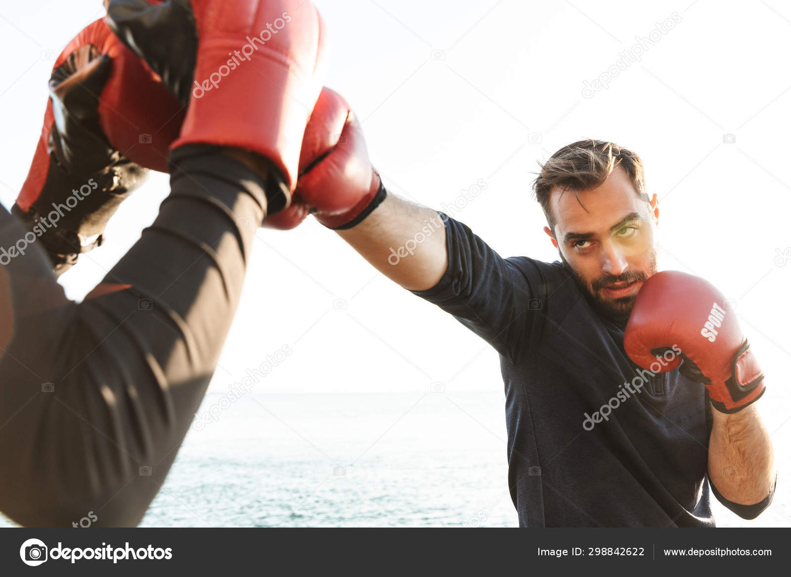 Concentrated handsome strong two young sports men boxers friends at the ...