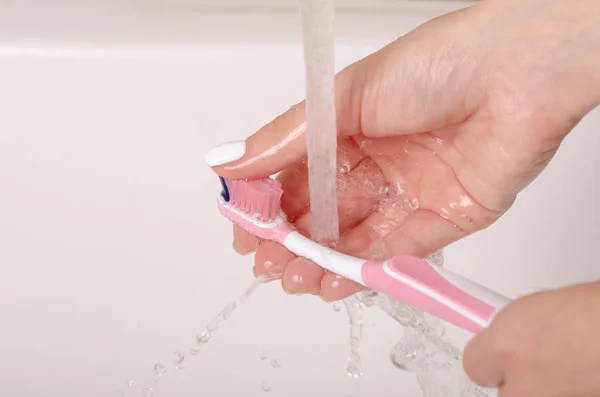 Toothbrush in the hands - Stock Image - Everypixel