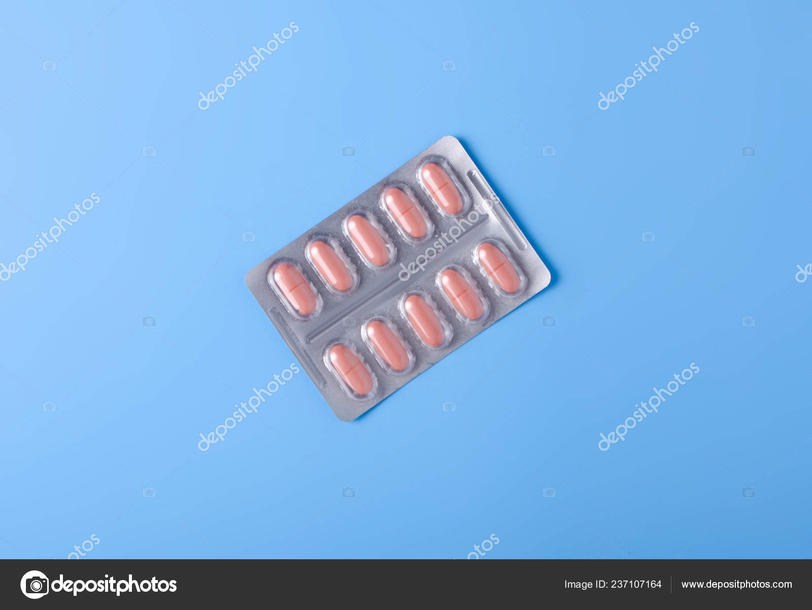 Blister rose capsule on blue background, top view — Stock Photo ...