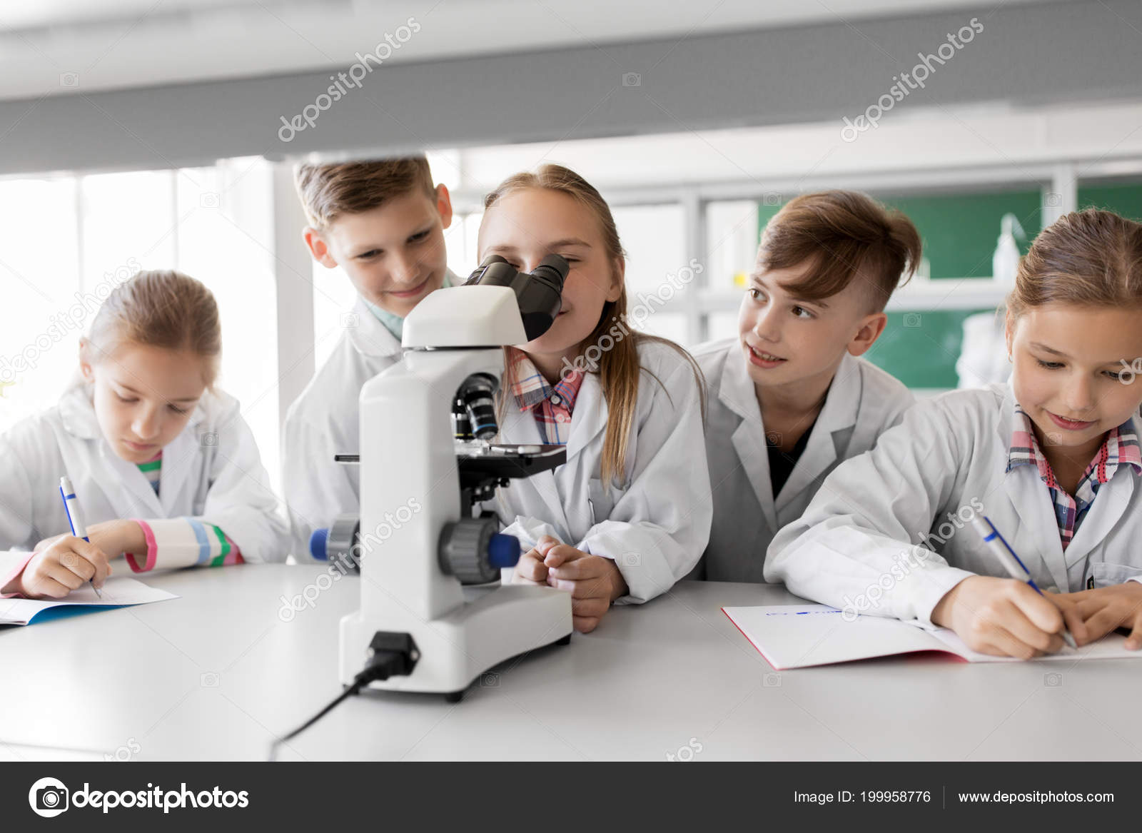Kids or students with microscope biology at school Stock Photo by ©Syda ...