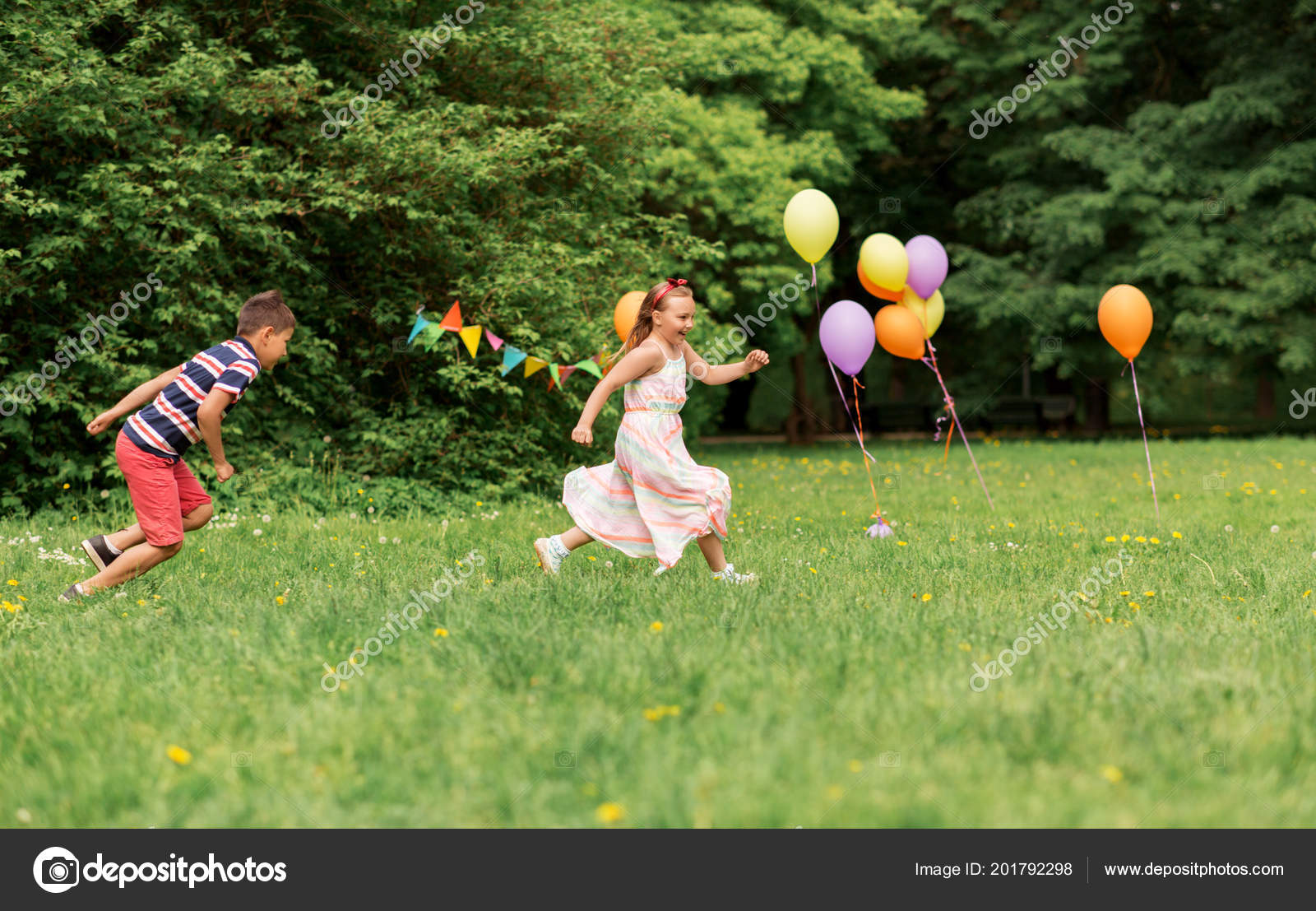 Happy kids playing tag game at birthday party Stock Photo by ©Syda ...