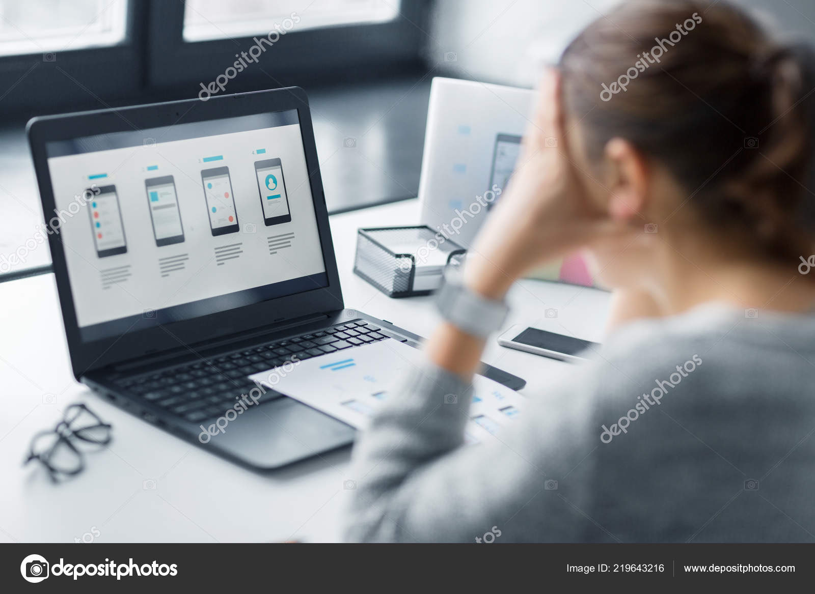 Stressed designer with user interface on laptop — Stock Photo © Syda ...
