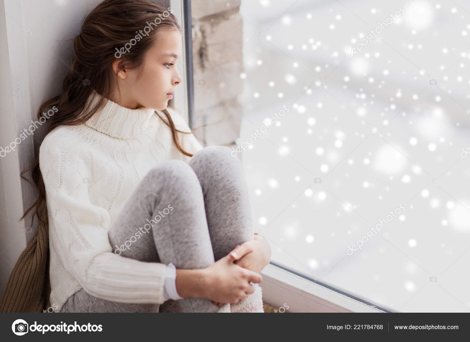 Sad girl sitting on sill at home window in winter Stock Photo by ©Syda ...