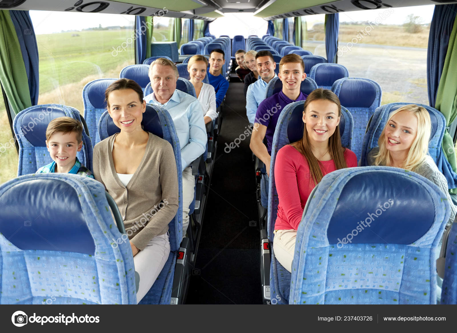 Group of happy passengers travelling by bus — Stock Photo © Syda ...