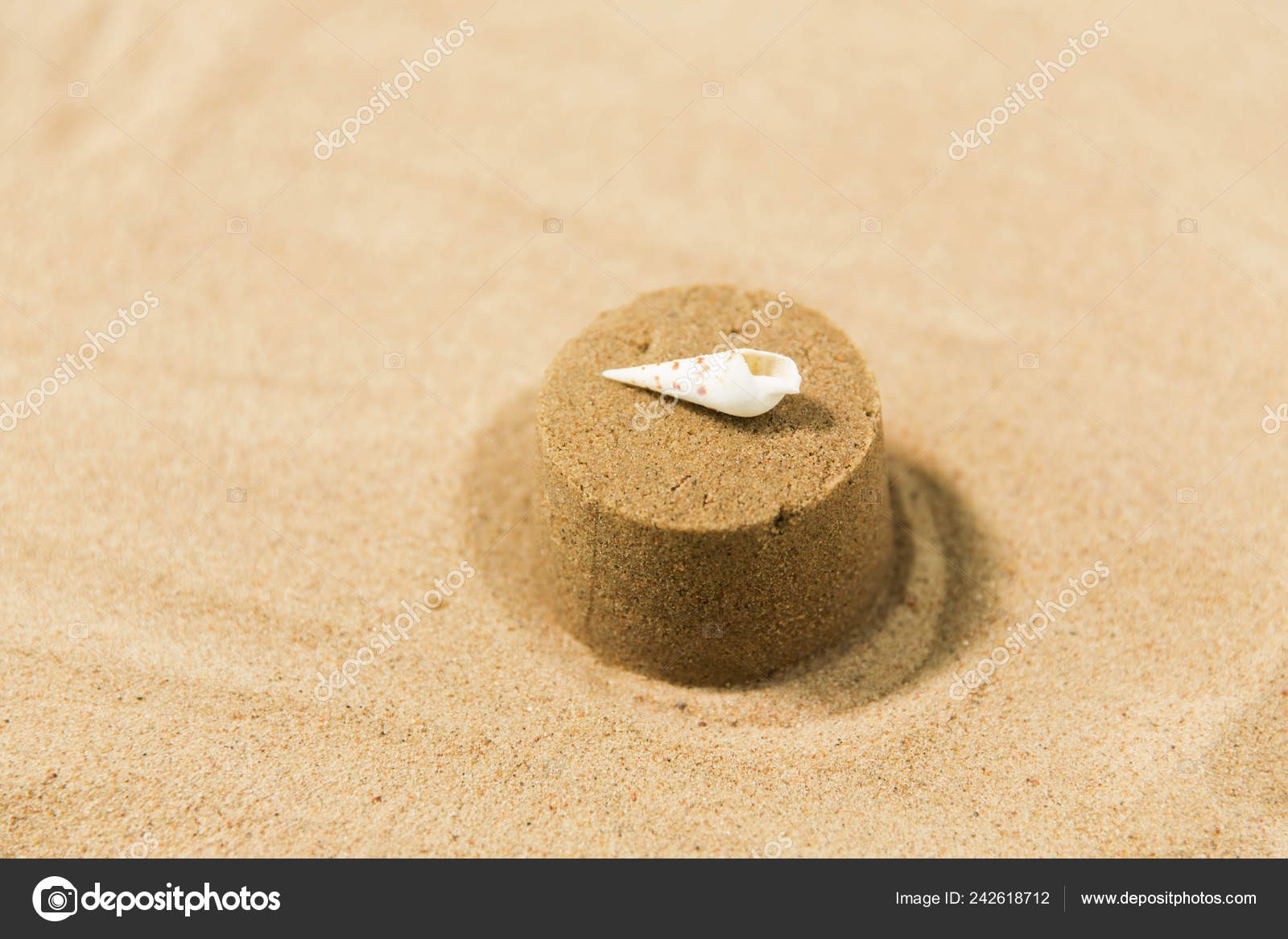 Sand shape made by mold with shell on summer beach Stock Photo by ©Syda ...