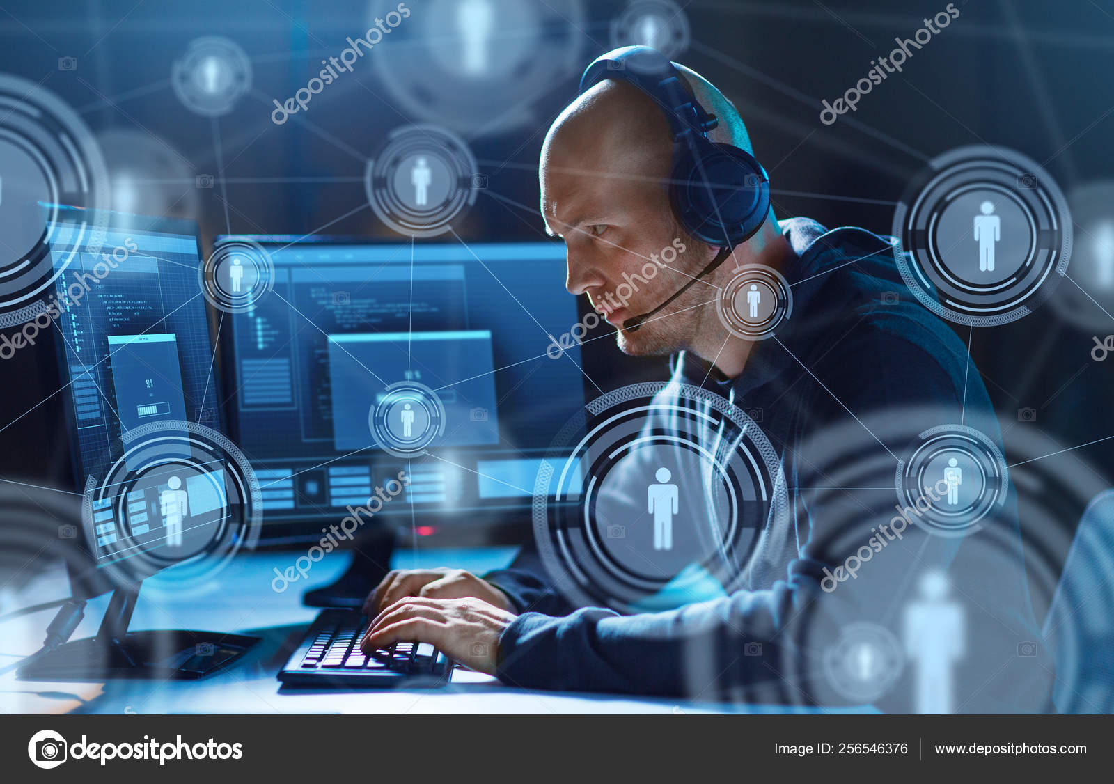 Hacker with computer and headset in dark room — Stock Photo © Syda ...
