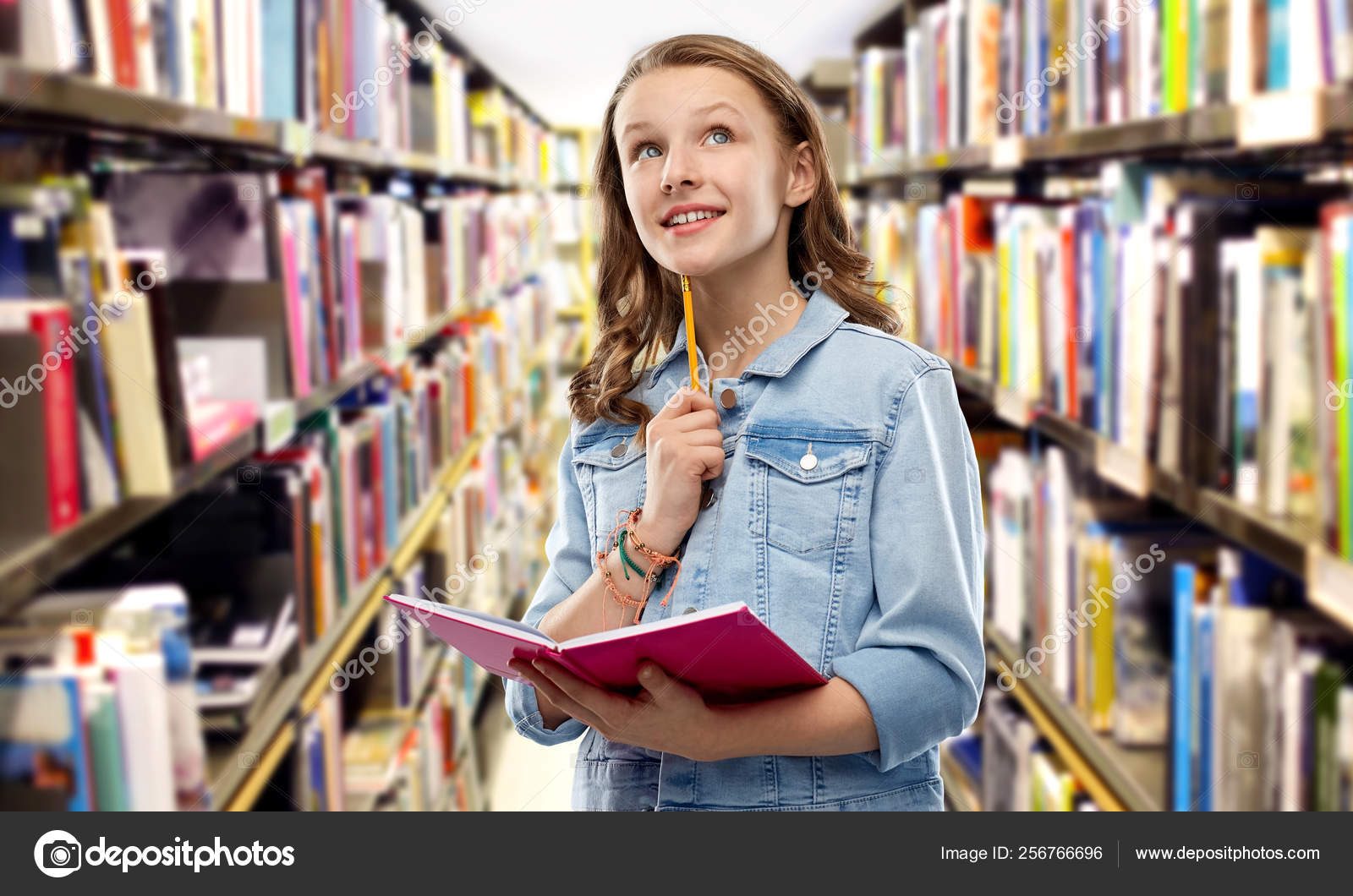 Student girl with diary or notebook at library Stock Photo by ©Syda ...