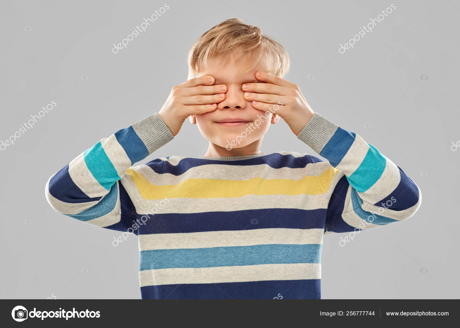 Boy in striped pullover closing his eyes by hands — Stock Photo © Syda ...