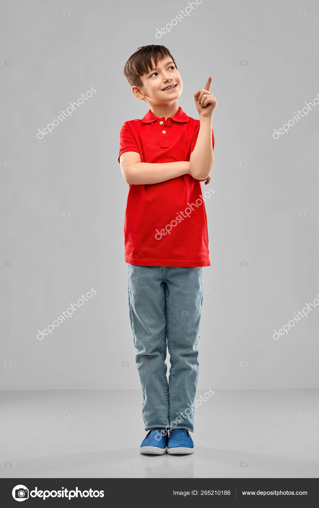 Little boy in red polo t-shirt pointing finger up Stock Photo by ©Syda ...