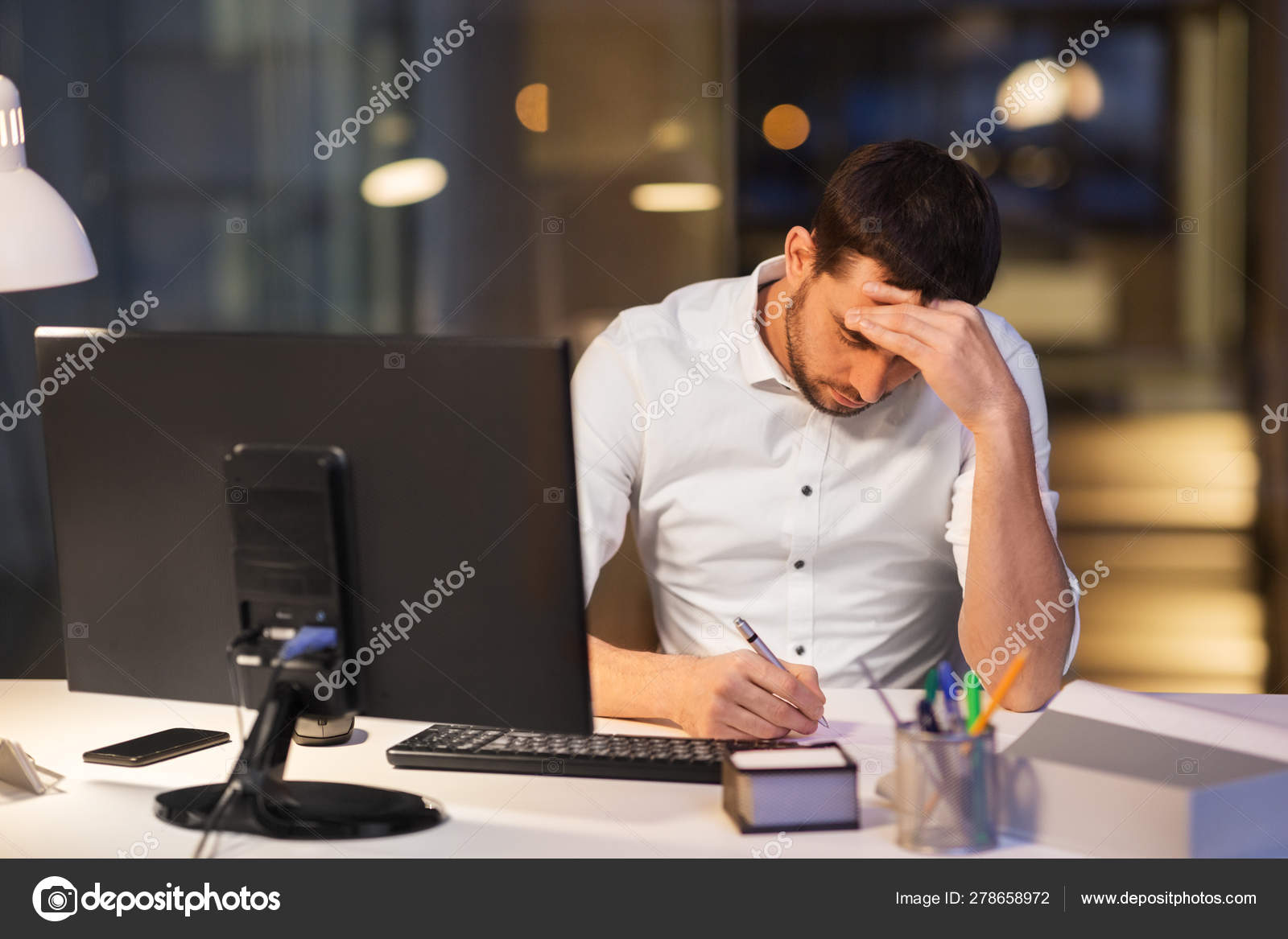 Businessman with computer working at night office Stock Photo by ©Syda ...