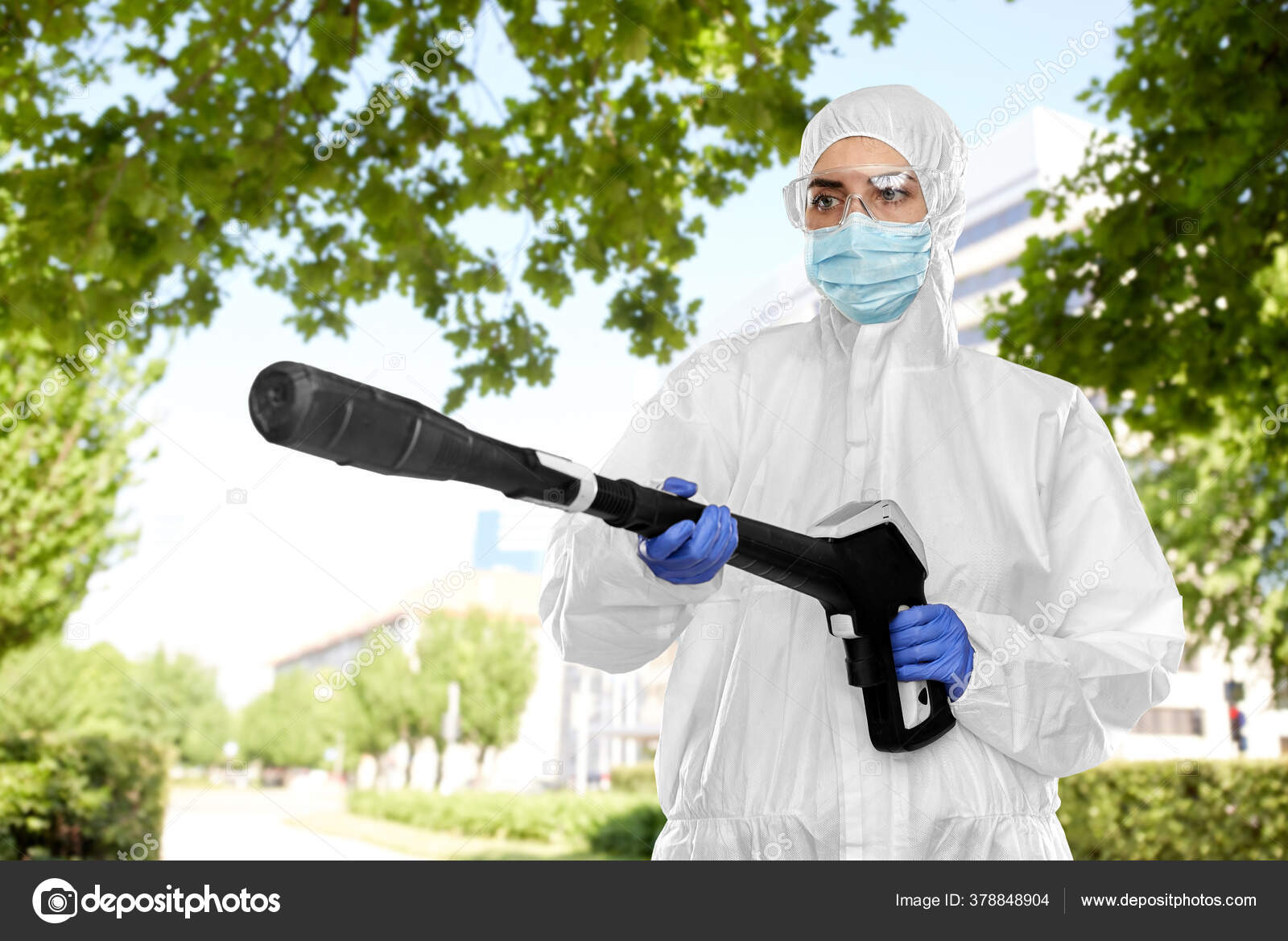 Sanitation worker in hazmat with pressure washer — Stock Photo © Syda ...
