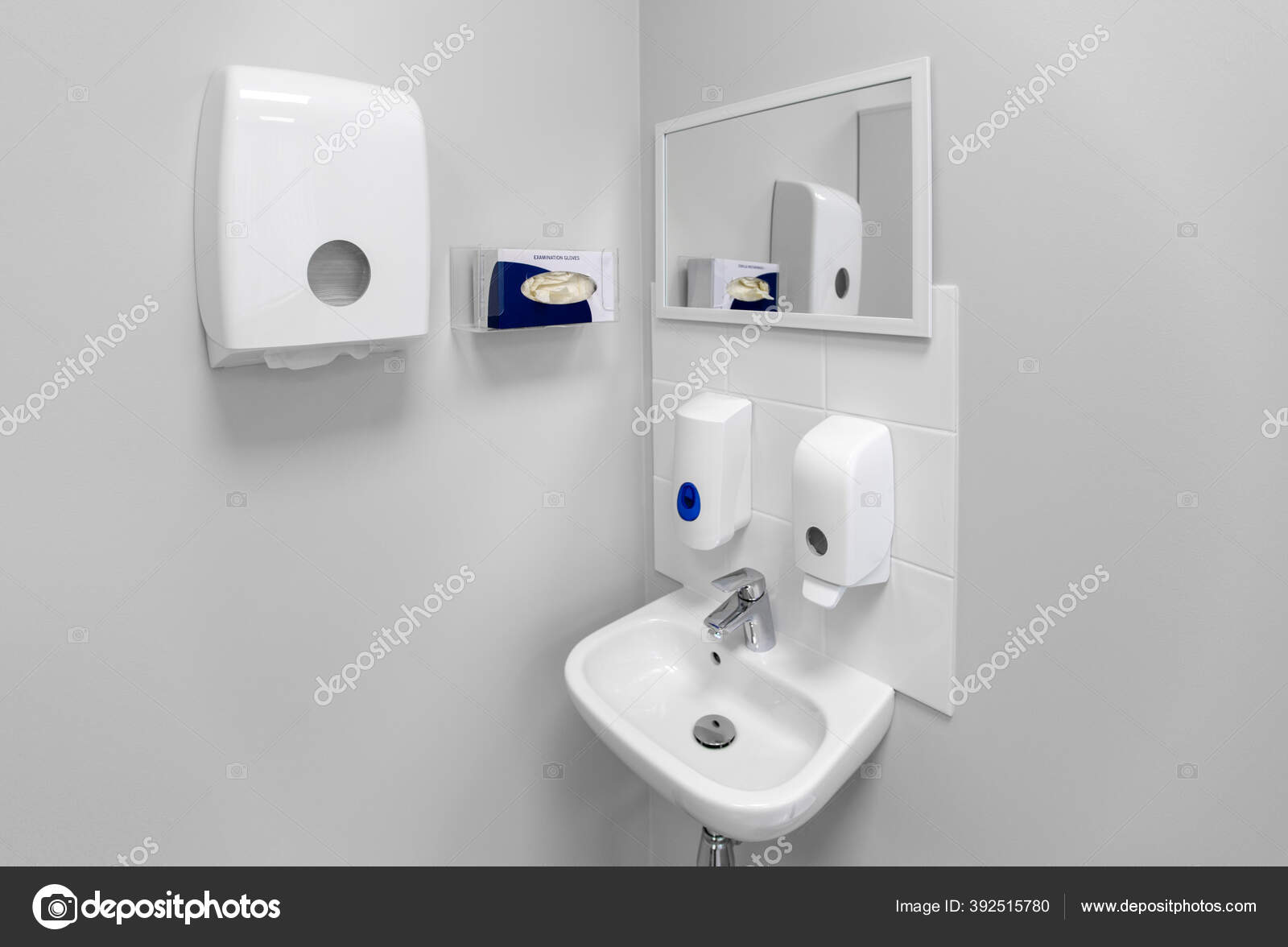 Hospital bathroom with sink, soap and paper towels Stock Photo by ©Syda ...