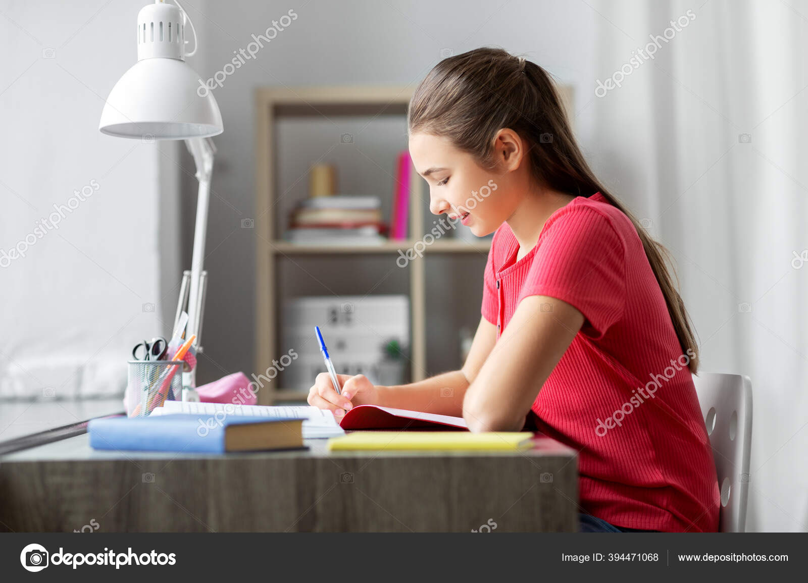 Student girl with book writing to notebook at home Stock Photo by ©Syda ...