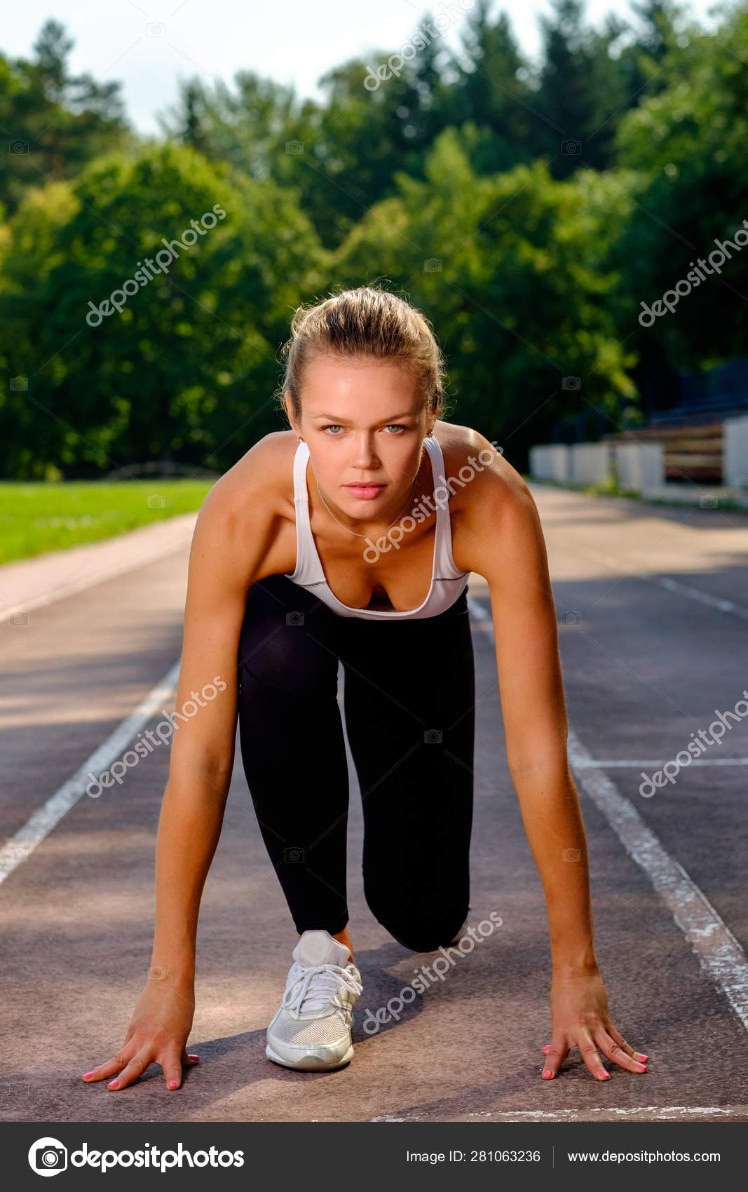 Attractive girl on start lane ready to run Stock Photo by ©bibacomua ...
