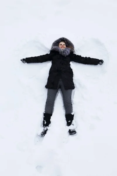 Woman snow angel Stock Photos, Royalty Free Woman snow angel Images ...