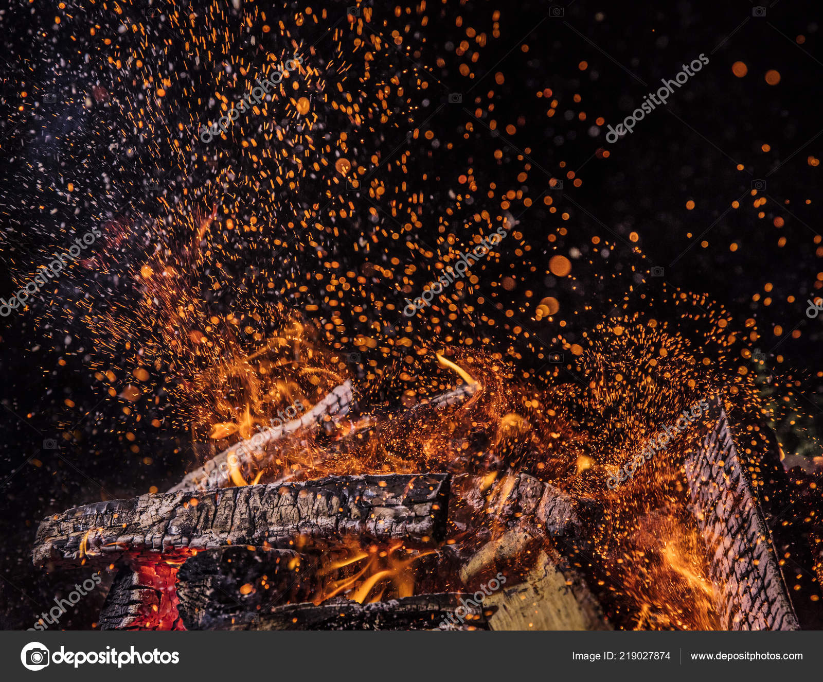 Flaming Logs, fire flames background. — Stock Photo © Kesu01 #219027874