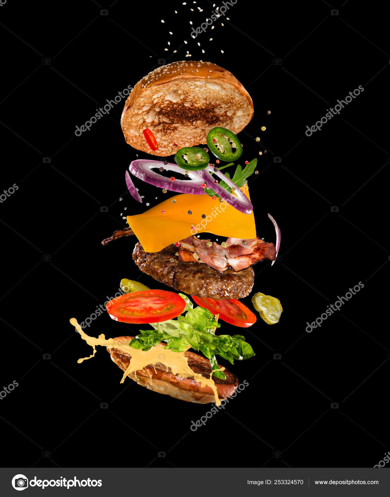 Tasty hamburger with flying ingredients on dark background Stock Photo ...