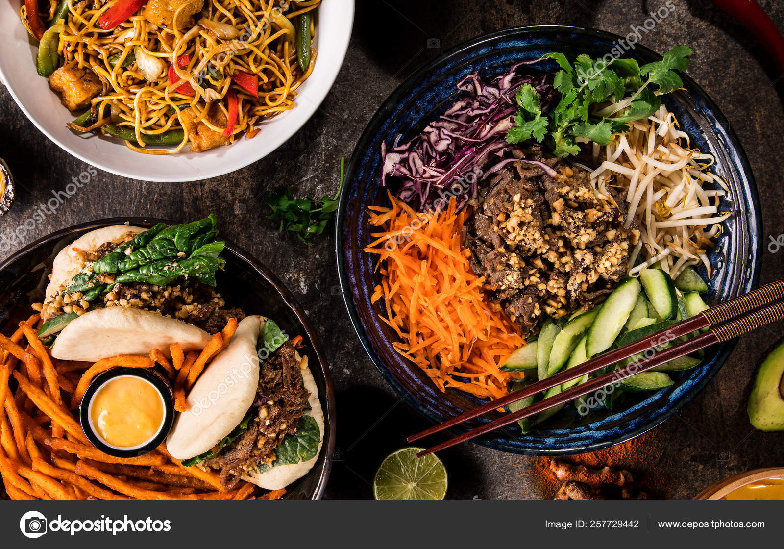 Asian food background with various ingredients on rustic stone ...