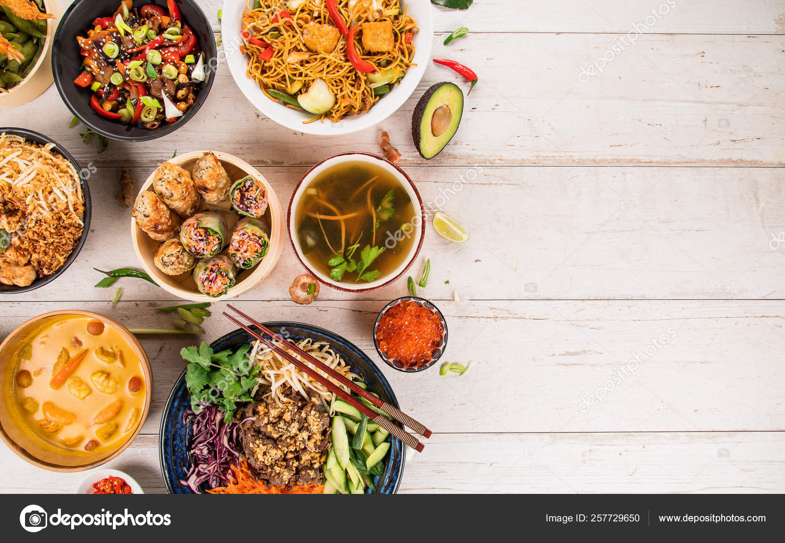 Asian food background with various ingredients on rustic wooden table ...