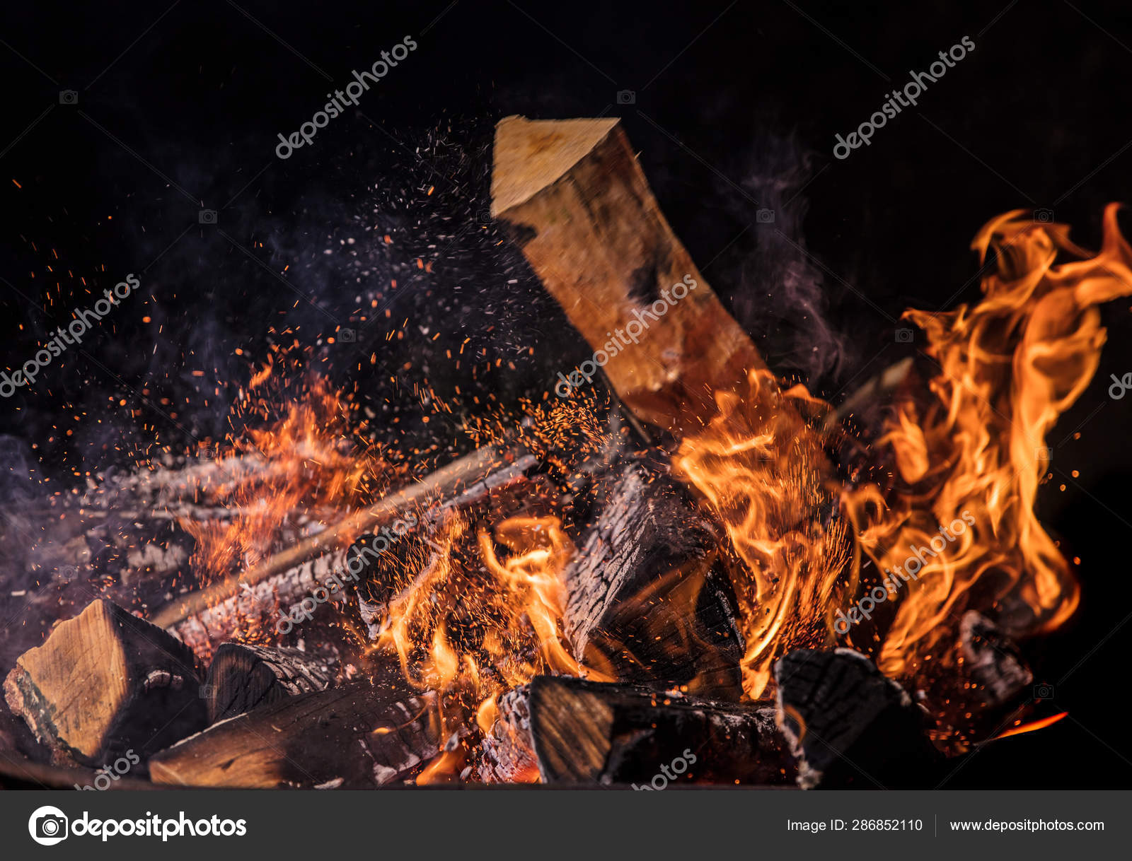 Flaming Logs, fire flames background. Stock Photo by ©Kesu01 286852110