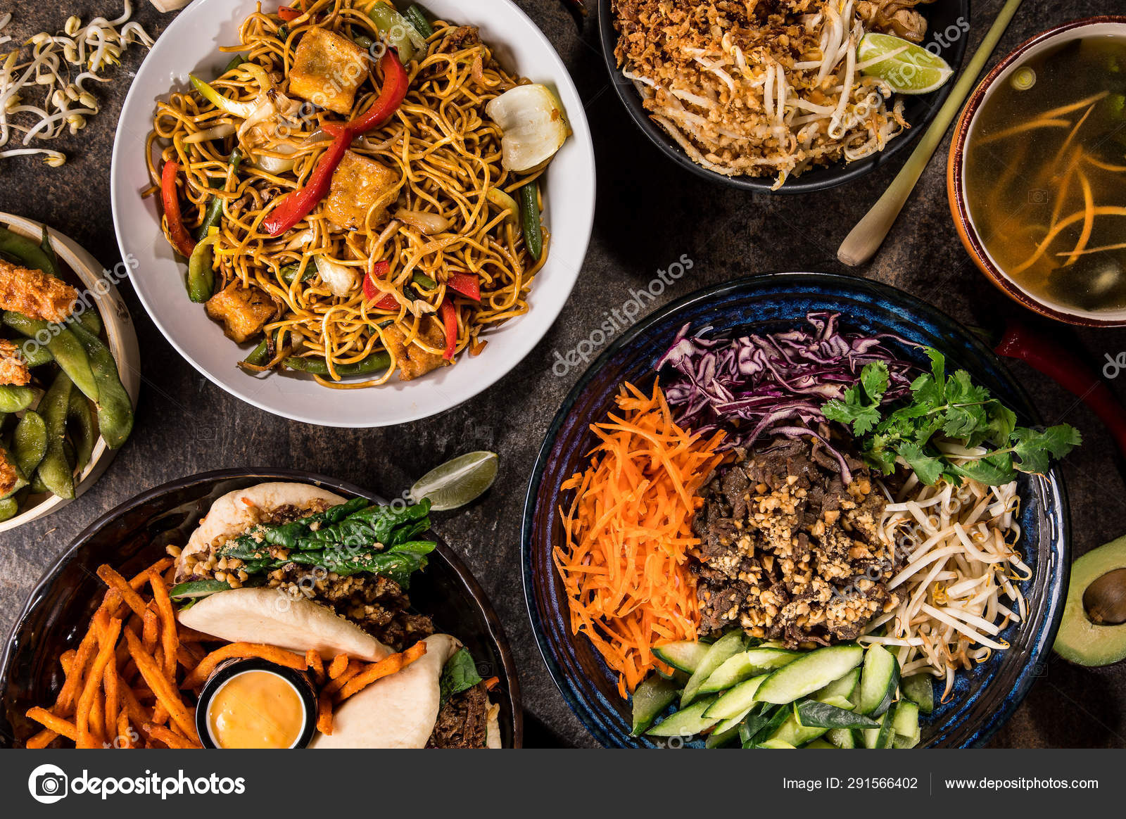 Asian food background with various ingredients on rustic wooden table ...