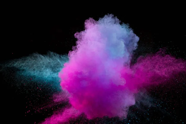 Colored powder explosion on black background. - Stock Image - Everypixel