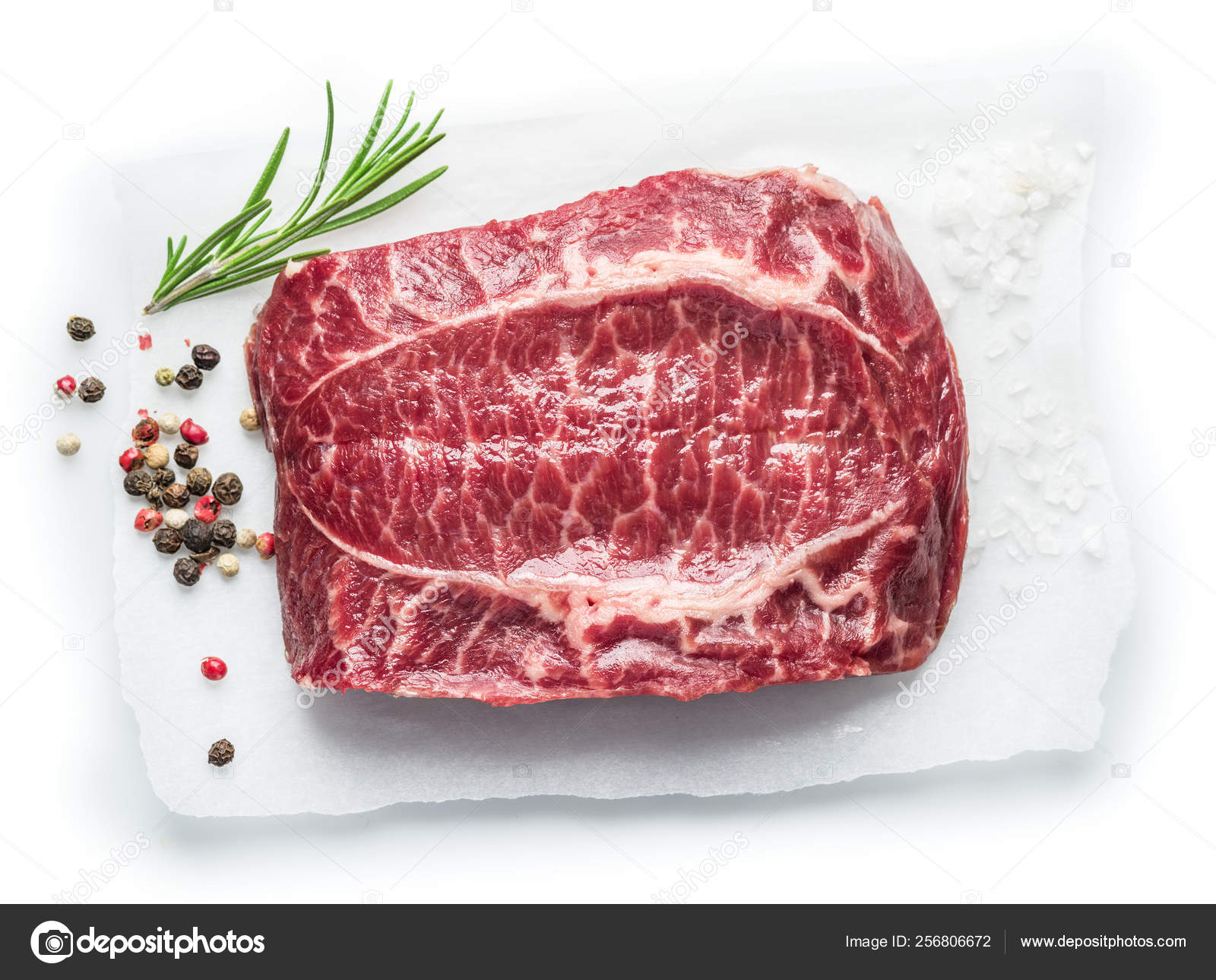The top blade steak or beef steak with herbs and spices on white Stock ...