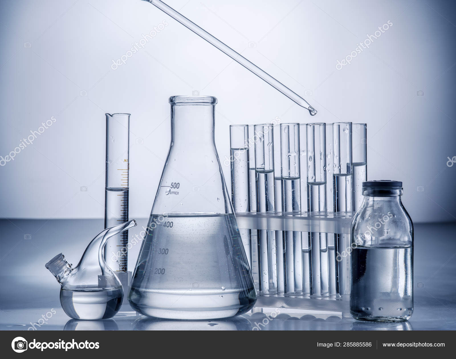 Different laboratory beakers and glassware. Stock Photo by ©Valentyn ...