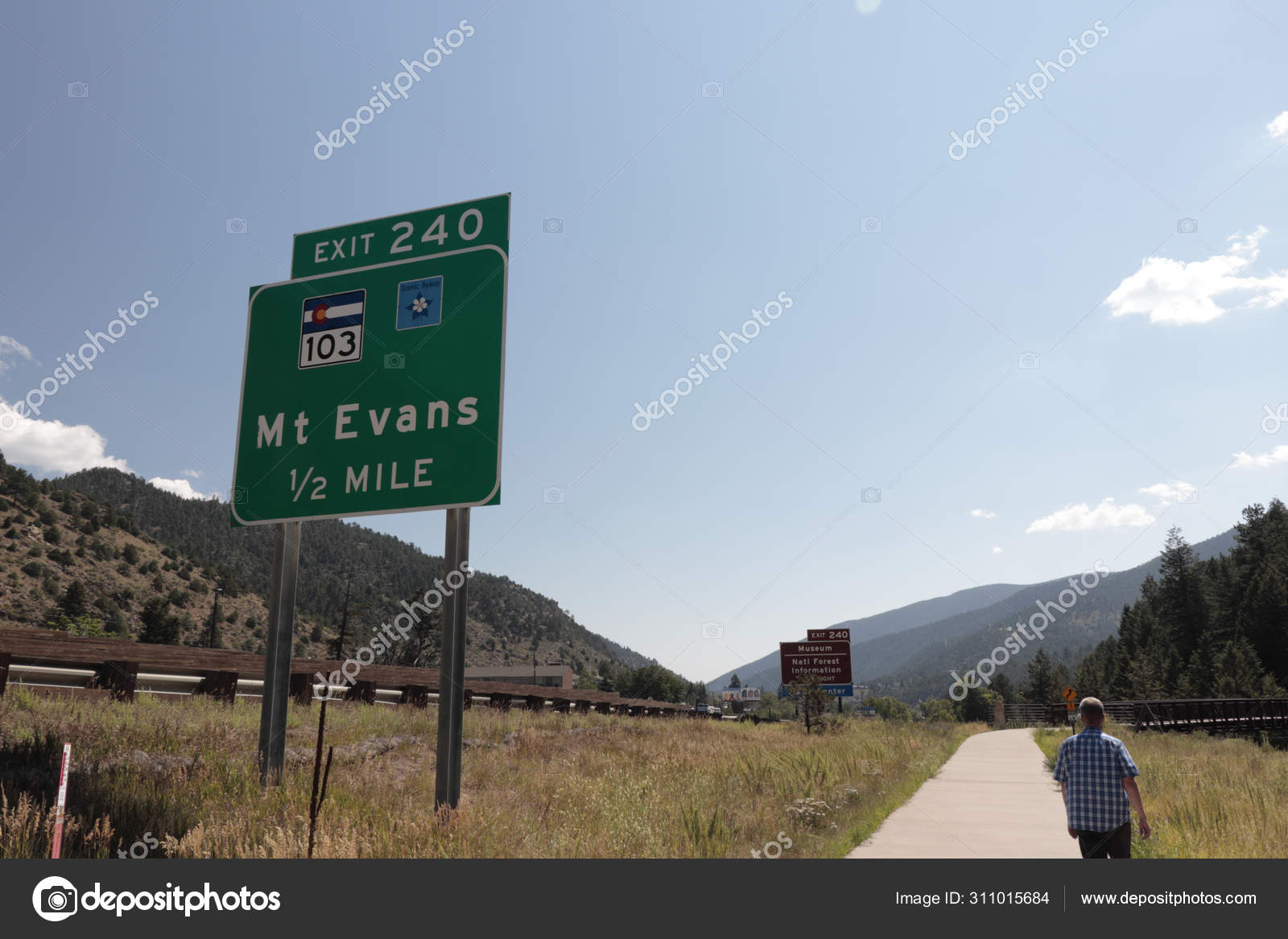 Person Walking Path Past Mt Evans I-70 Exit 240 Roadway Sign — Stock ...