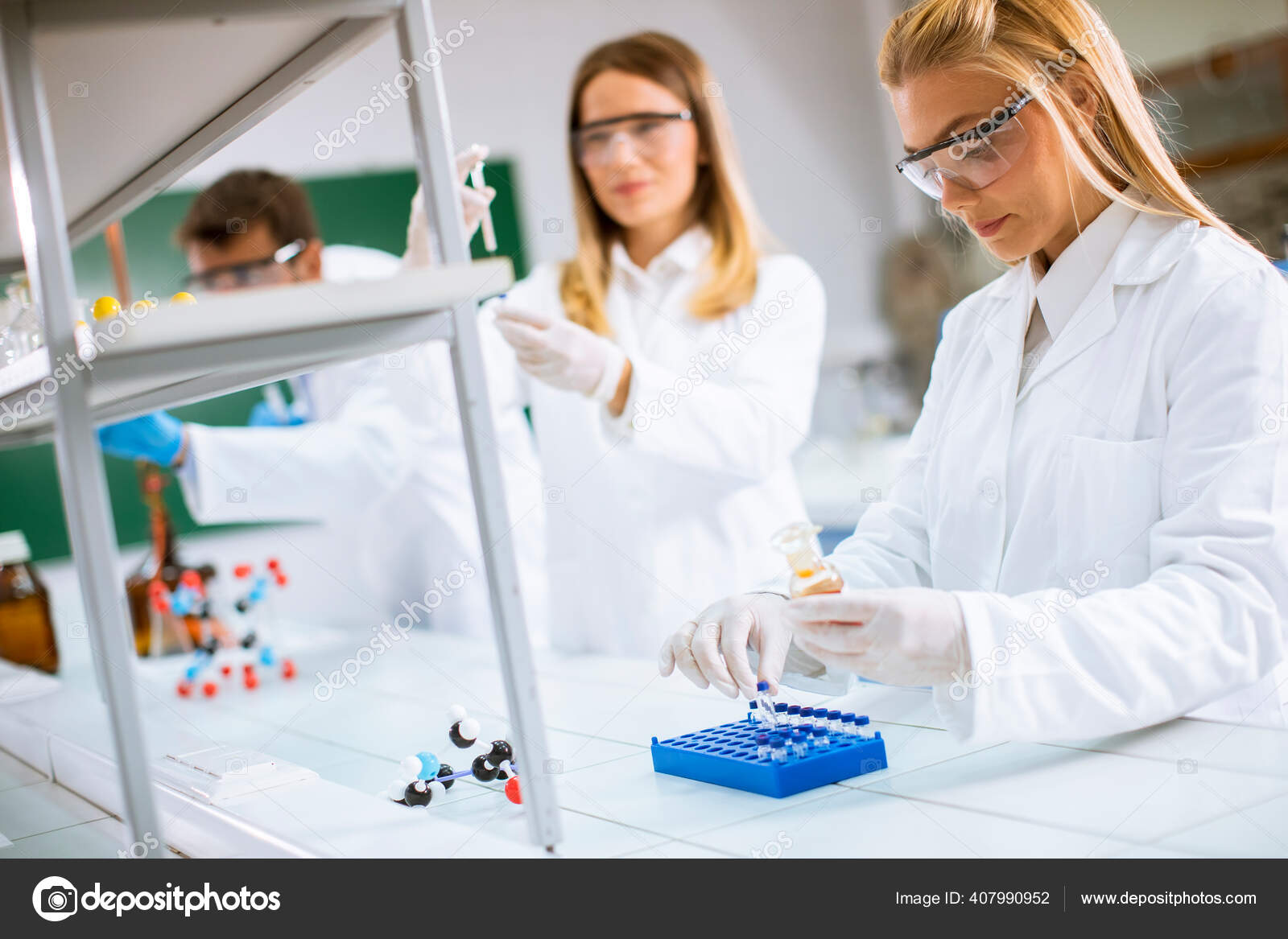Young Researchers Analyzing Chemical Data Laboratory Stock Photo by ...