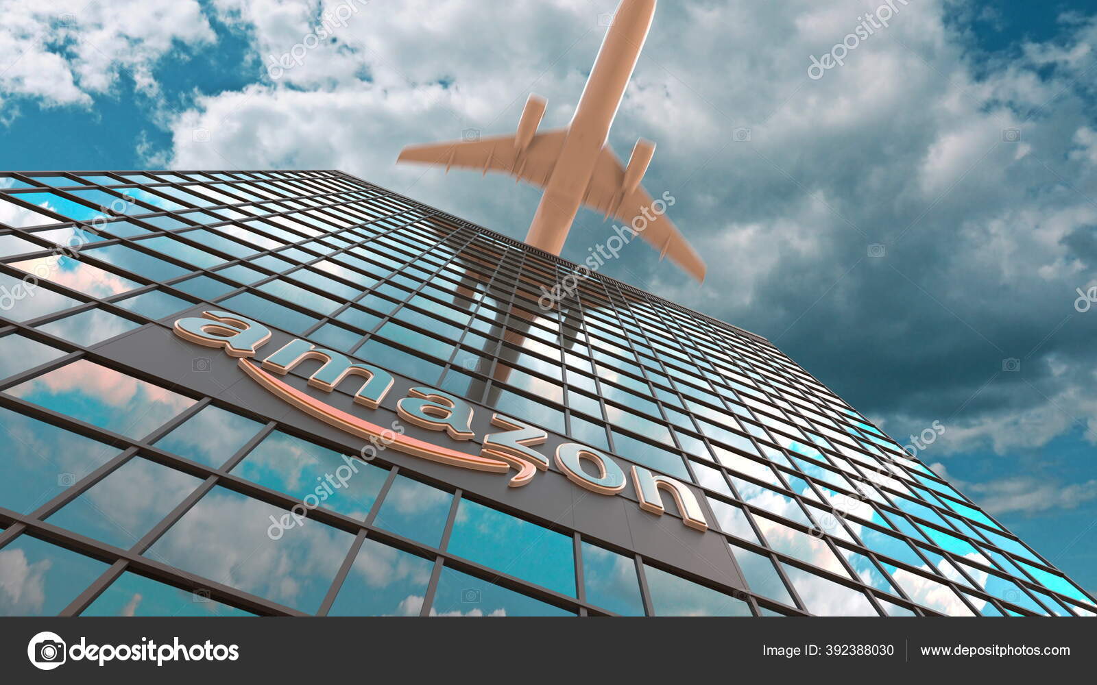 Amazon logo on a modern skyscraper reflecting clouds and flying ...