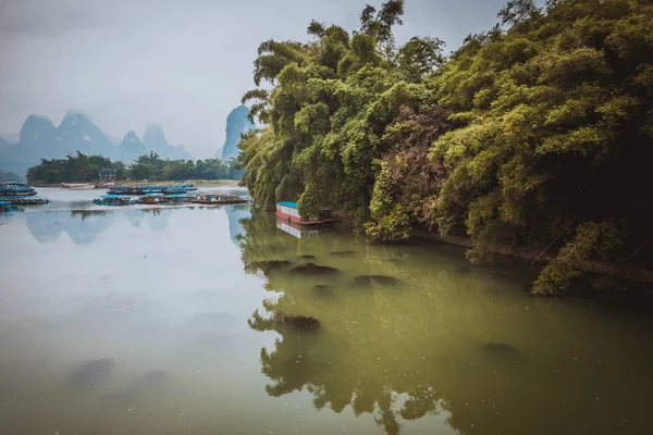 Li River (Lijiang River). Pleasure boats at the pier in Xingping Town ...
