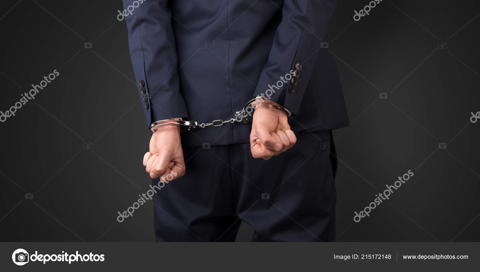 Dark backgrounded close handcuffed man Stock Photo by ©ra2studio 215172148