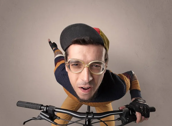 Crazy cyclist with empty background Stock Photo by ©ra2studio 196402150