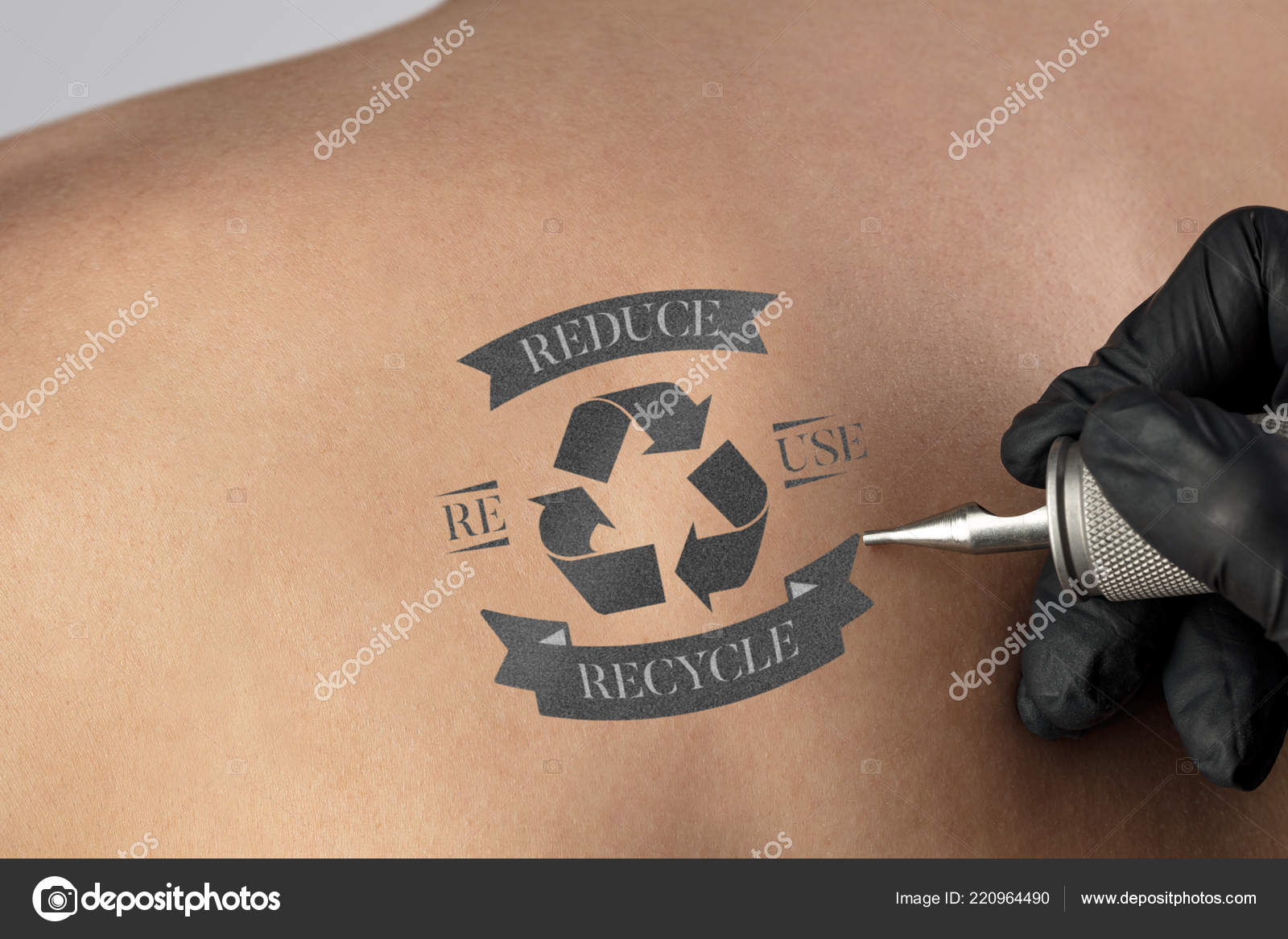Tattooing recycle for a better environment concept on naked back Stock ...