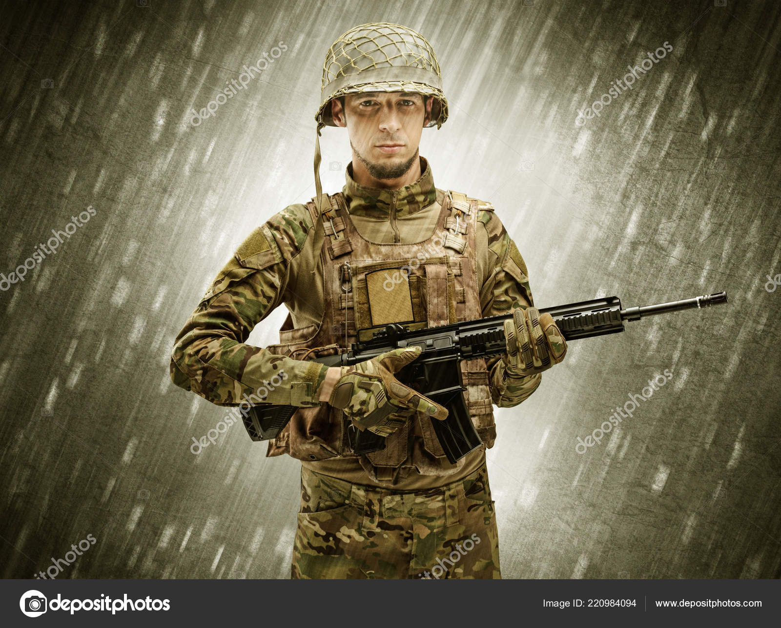 Armed soldier standing in rain Stock Photo by ©ra2studio 220984094
