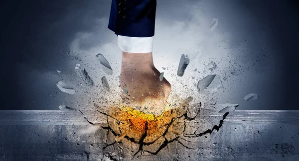 Hand hits intense and breaks stonewall — Stock Photo © ra2studio #228263394