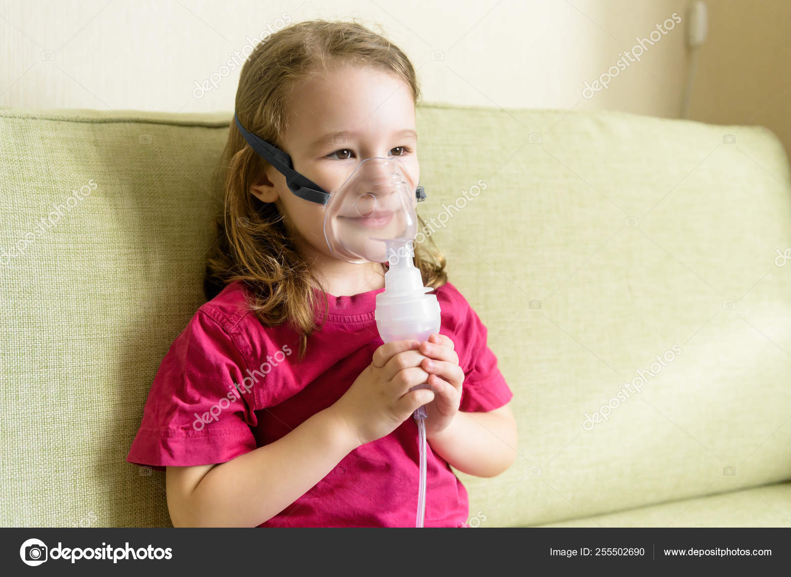 Little girl using inhaler mask at home Stock Photo by ©scaliger 255502690